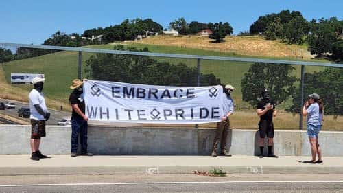 Protests are triggered when masked individuals hang a “white pride ...
